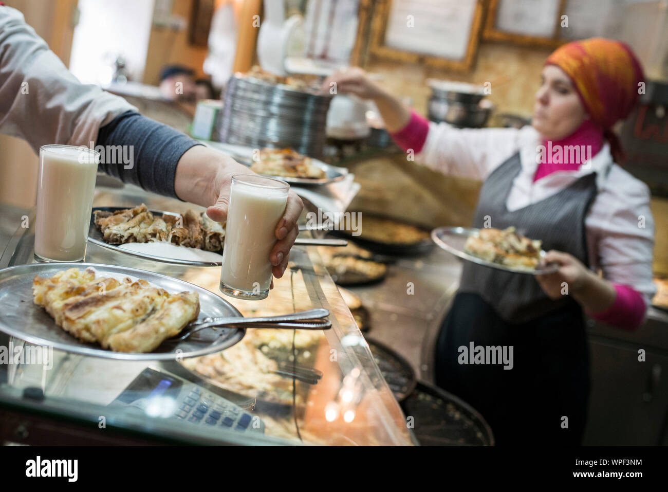 Bosnian traditional fast, street food: Bosnian pie and cevapcici served ...