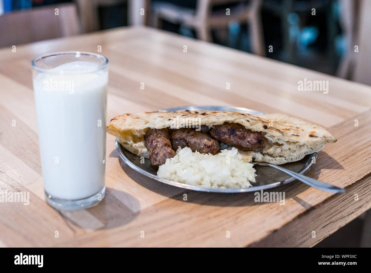 Bosnian traditional fast, street food: Bosnian pie and cevapcici served ...