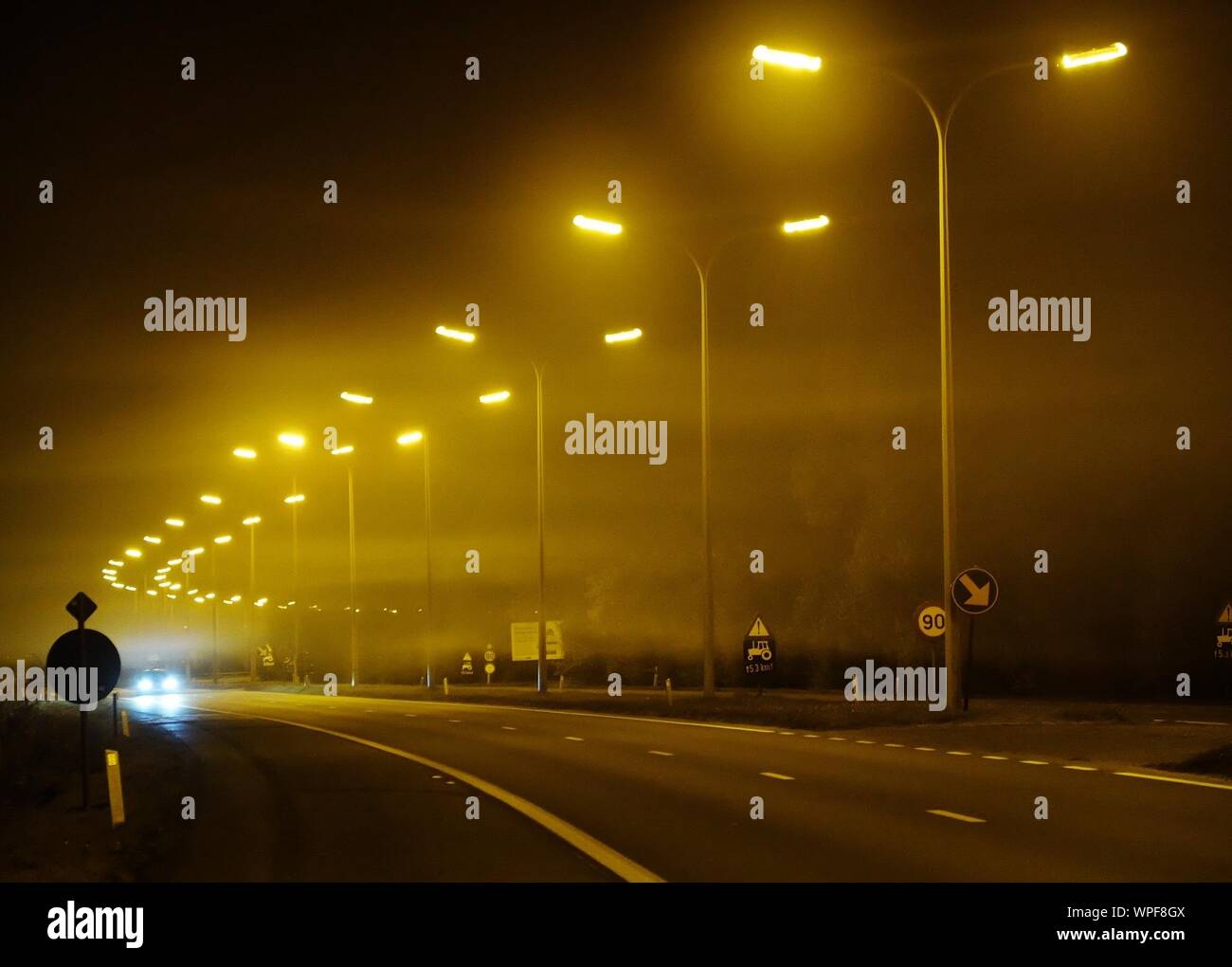Foggy road street lighting night hi-res stock photography and images ...