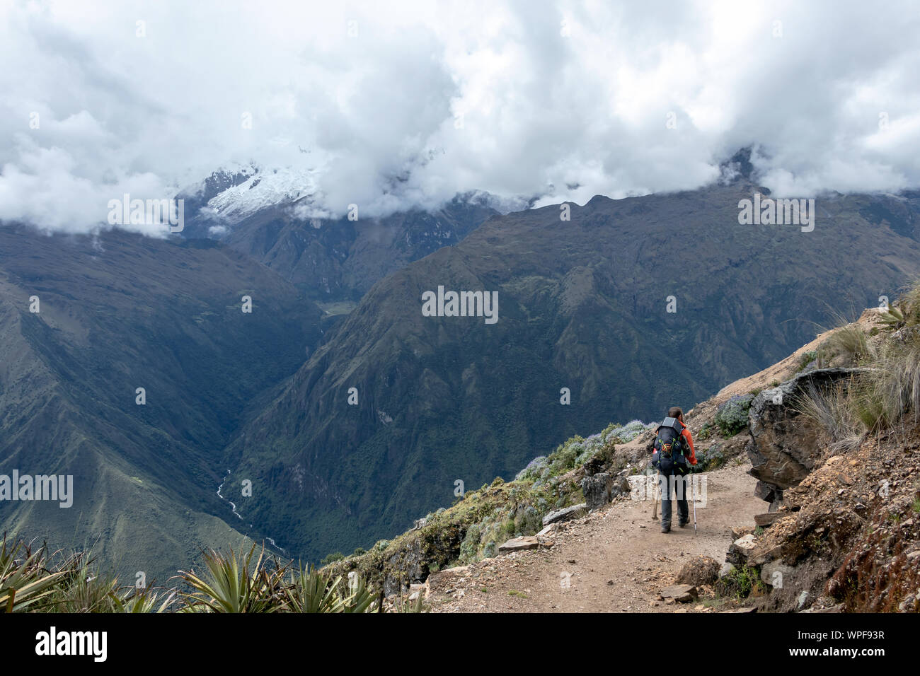 Young hiker man trekking with backpack in Peruvian mountains. Active ...