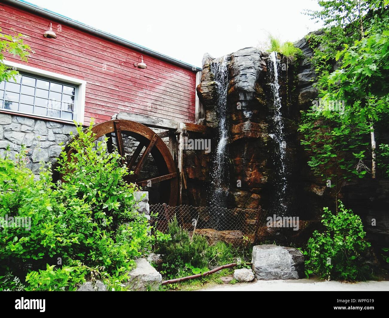 House and waterfall hi-res stock photography and images - Alamy