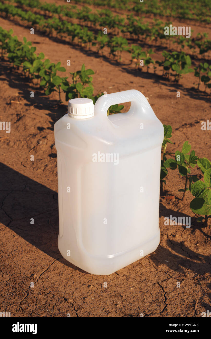 Soybean crop protection concept with blank generic pesticide canister ...