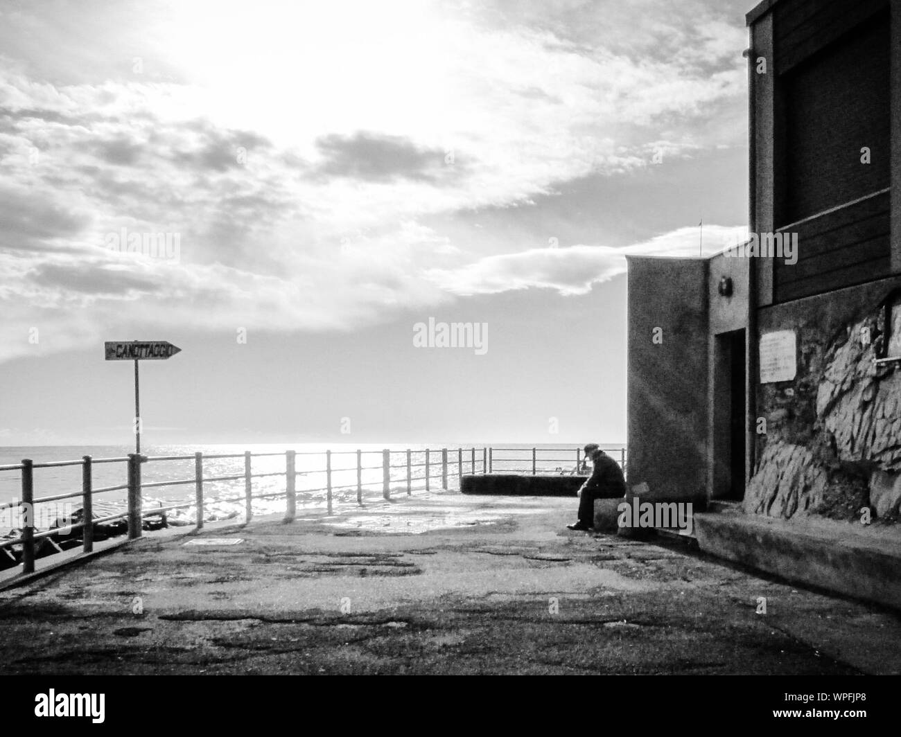 Man Sitting Outside Building High Resolution Stock Photography and ...