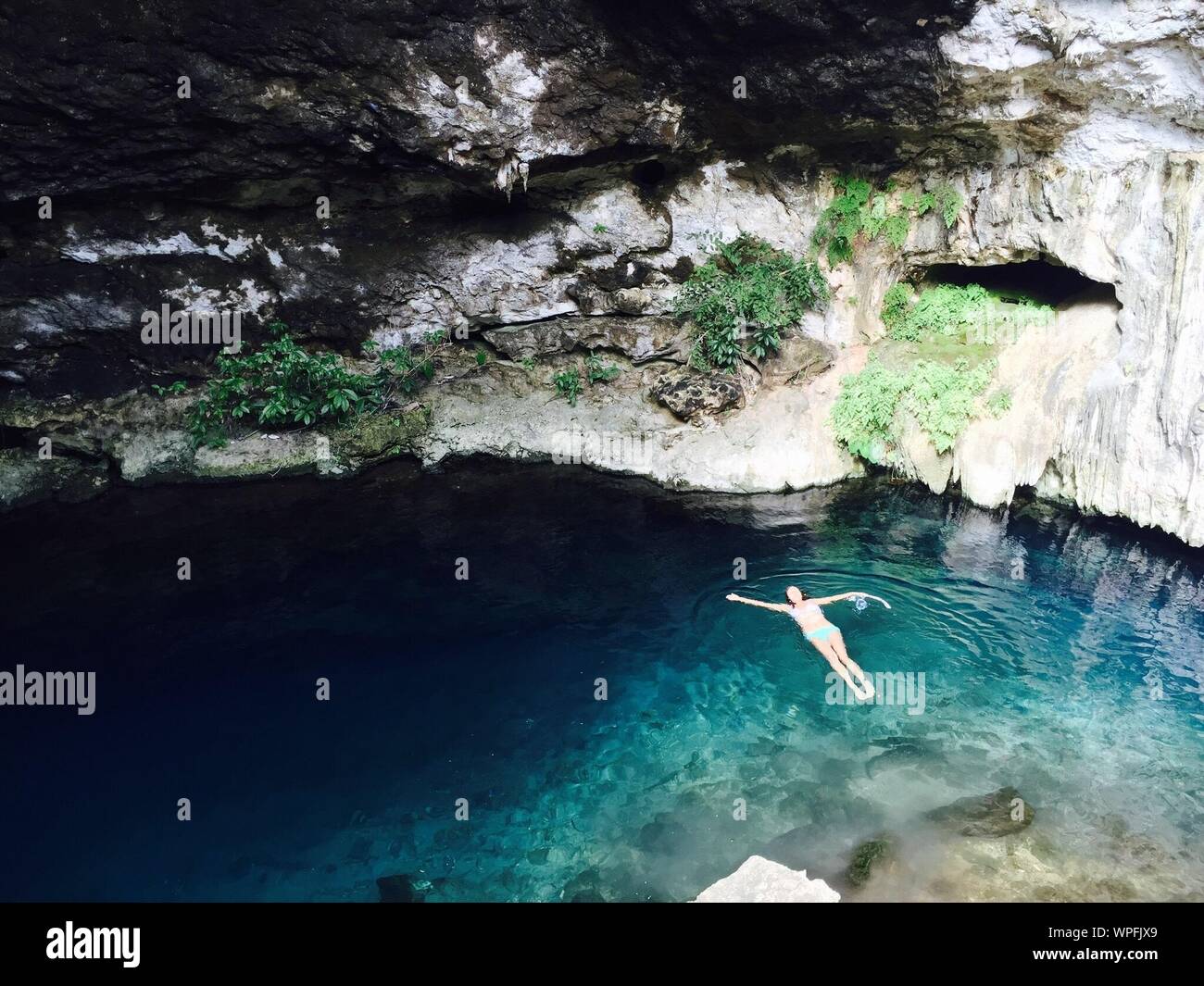 Person swimming in cenote hi-res stock photography and images - Alamy