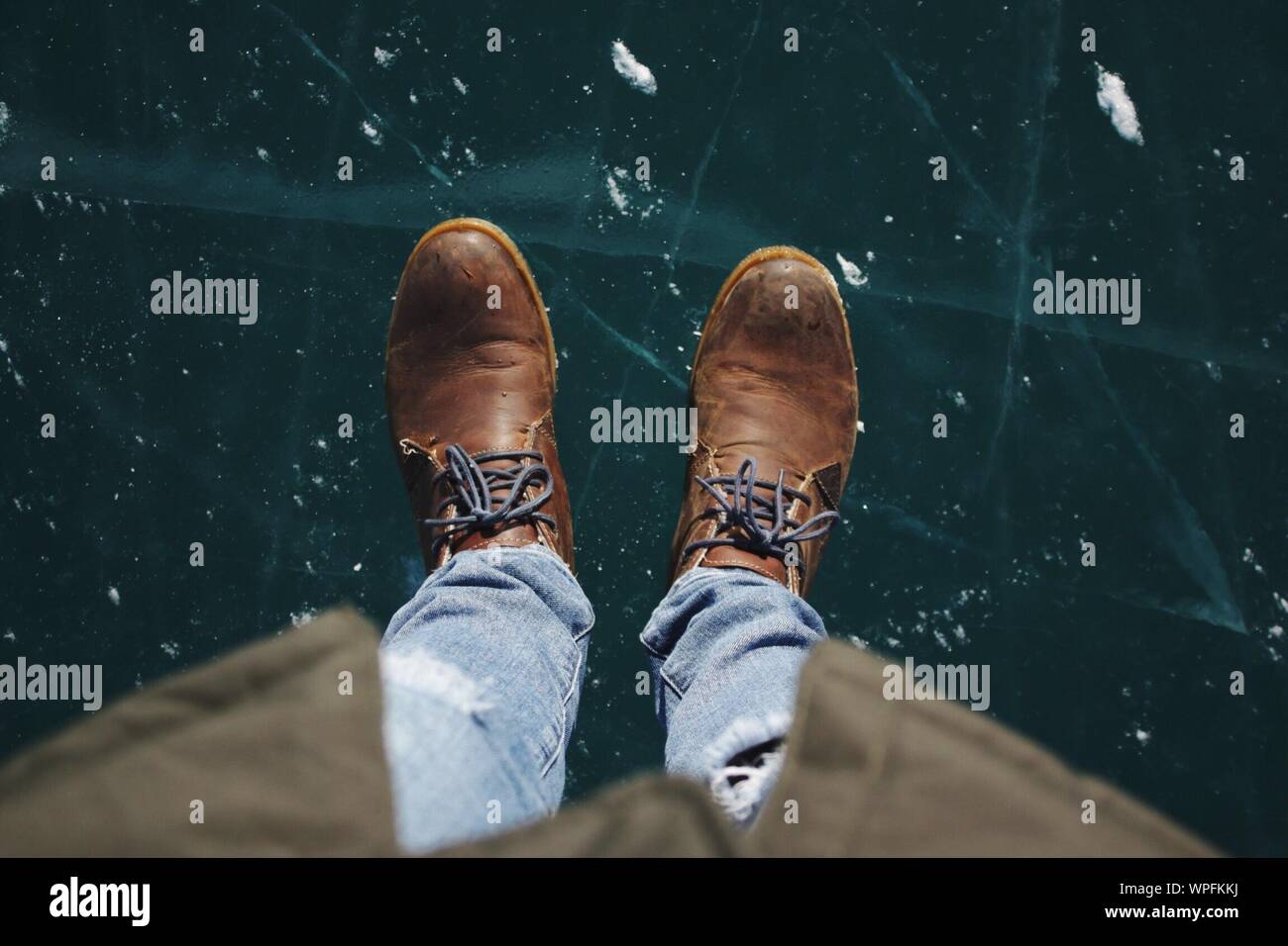Man standing feet water hi-res stock photography and images - Alamy