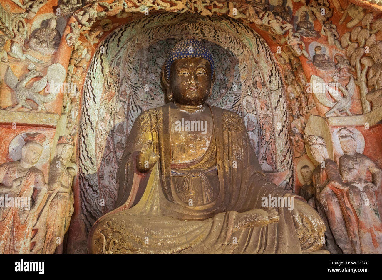 Buddha statue in cave 6 of the Yungang Grottoes near Datong Stock Photo ...