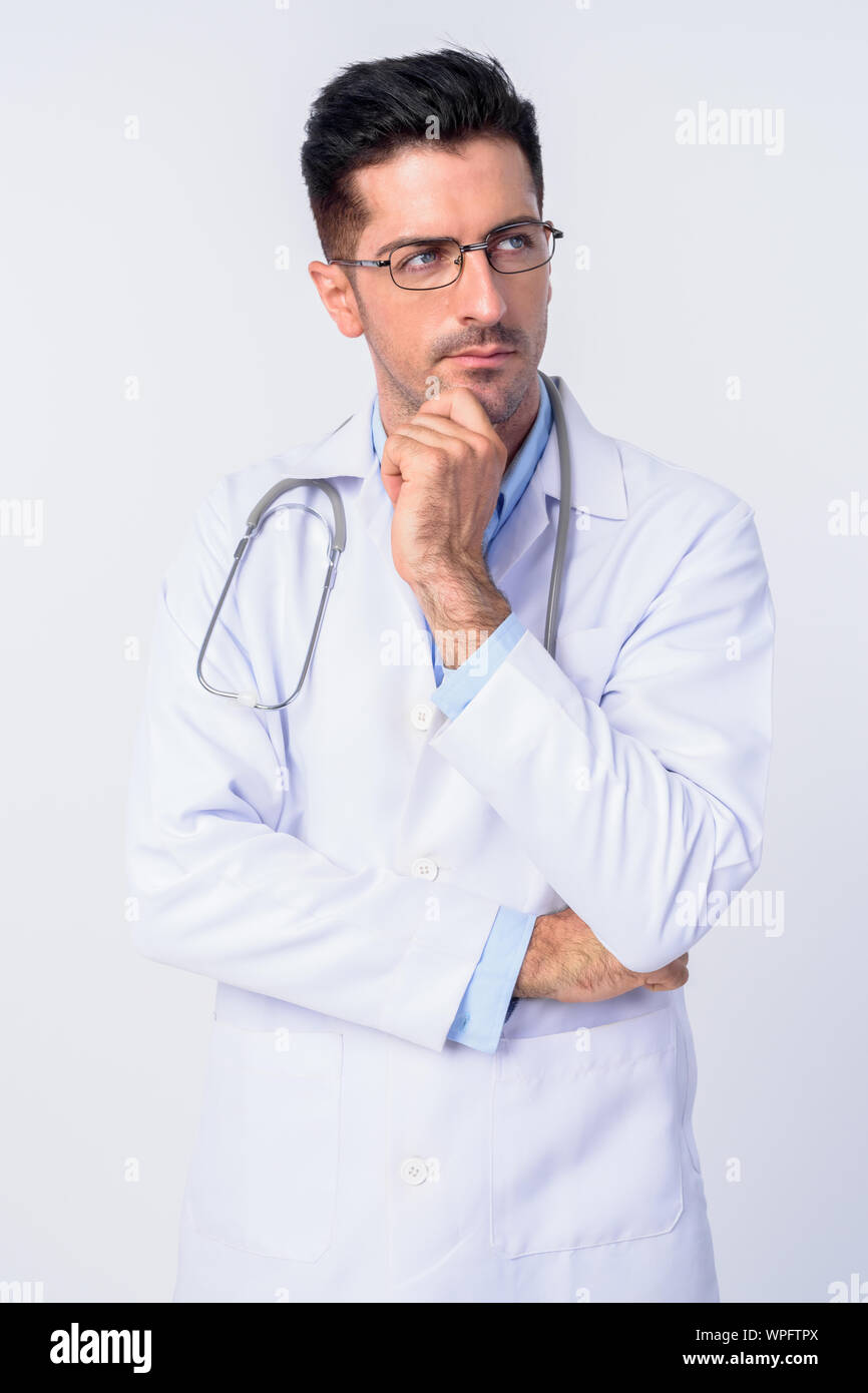 Young handsome man doctor with eyeglasses thinking and looking up Stock ...