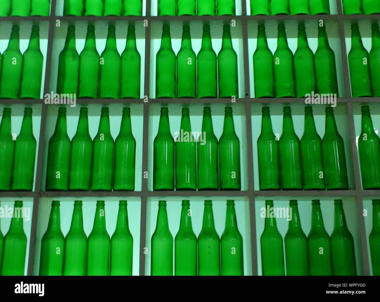 Green empty beer bottles in shelf arrangement hi-res stock photography ...