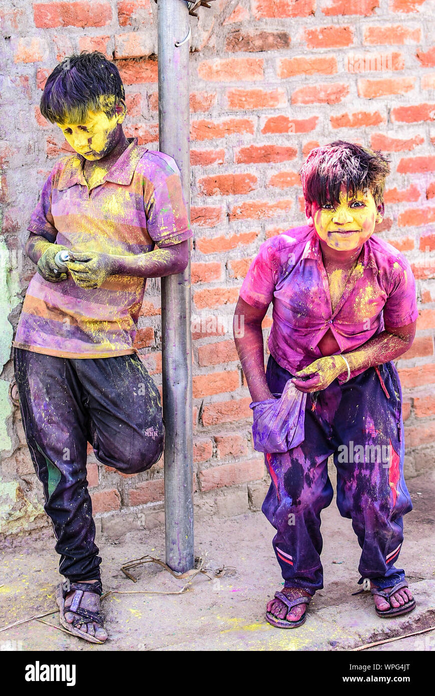 Full Length Of Children Covered In Multi Colored Powder Paint Stock ...