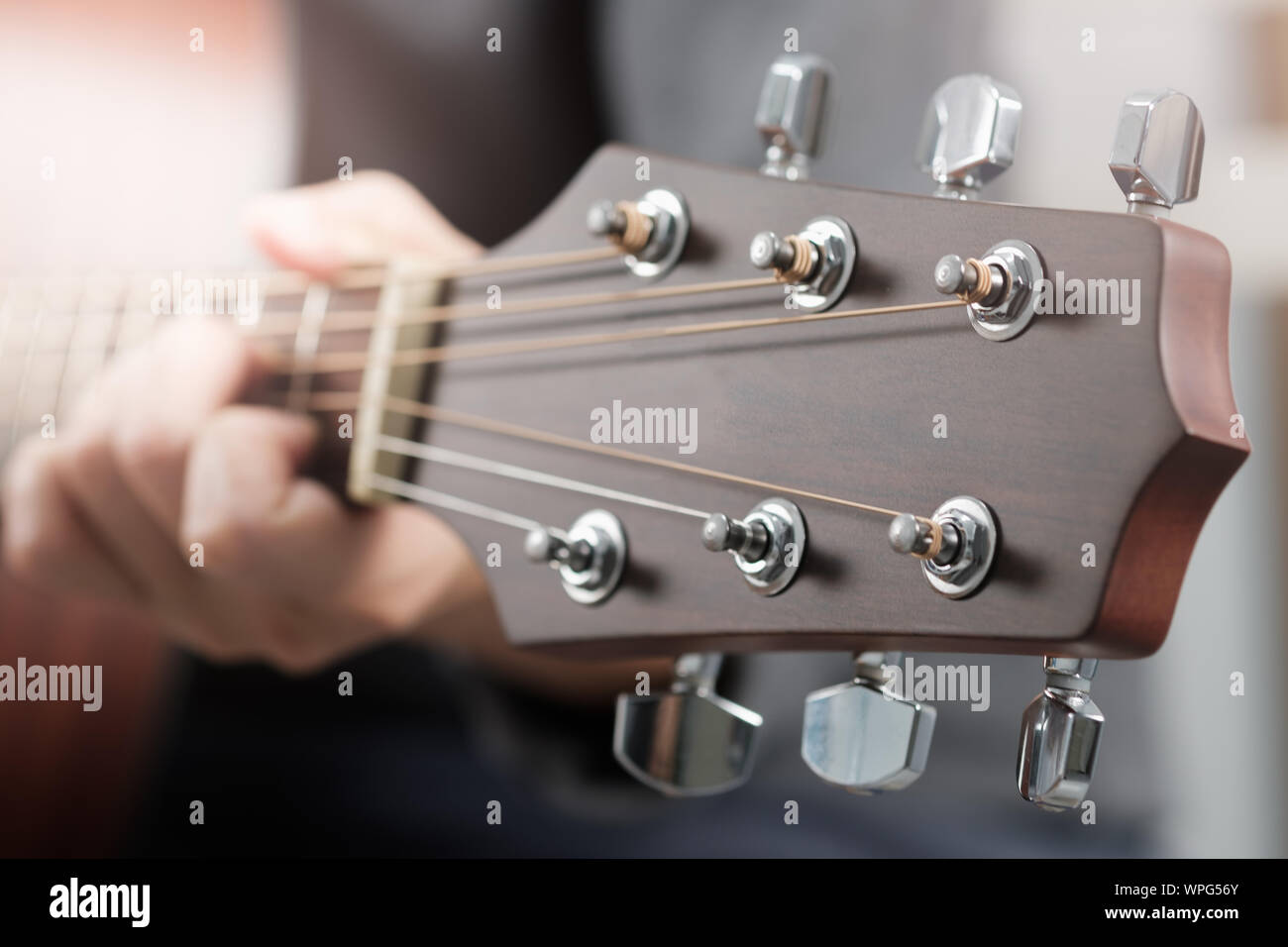 Close up woman's hands playing acoustic guitar Stock Photo - Alamy
