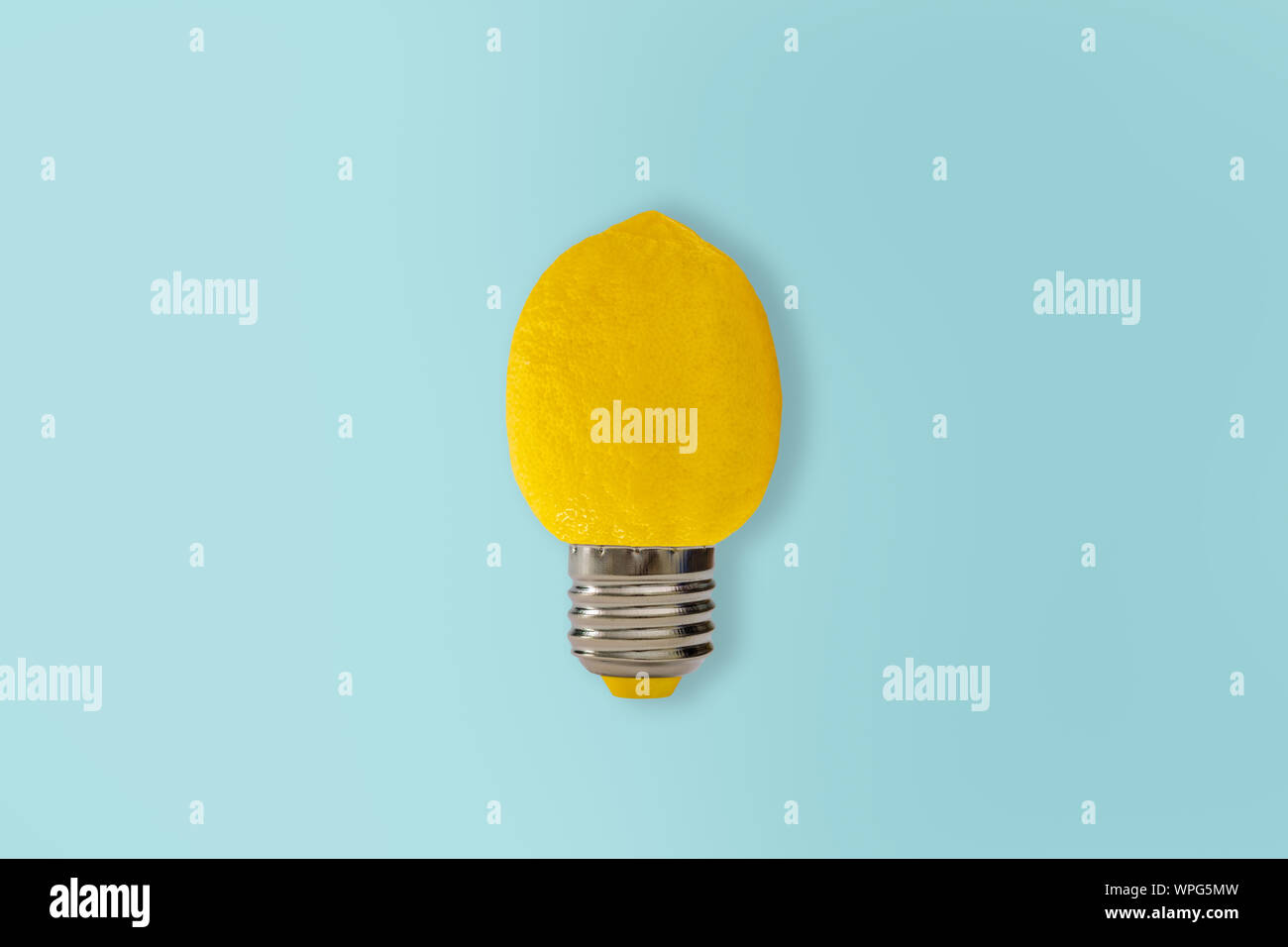Yellow Lemon light bulb on bright blue background. Summer fun concept ...