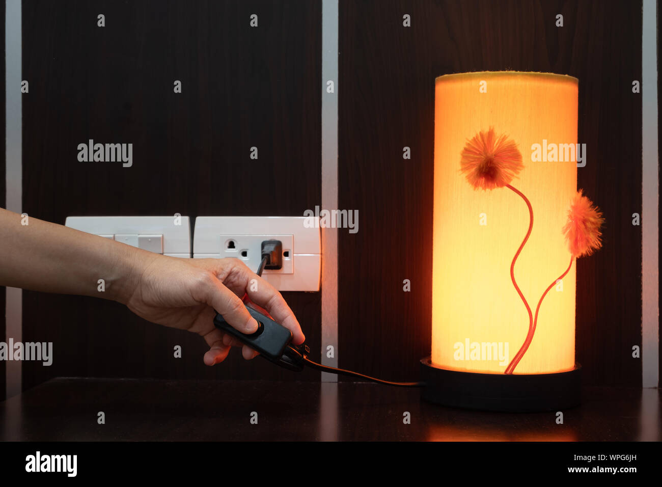 Family turning off light switch hi-res stock photography and images - Alamy