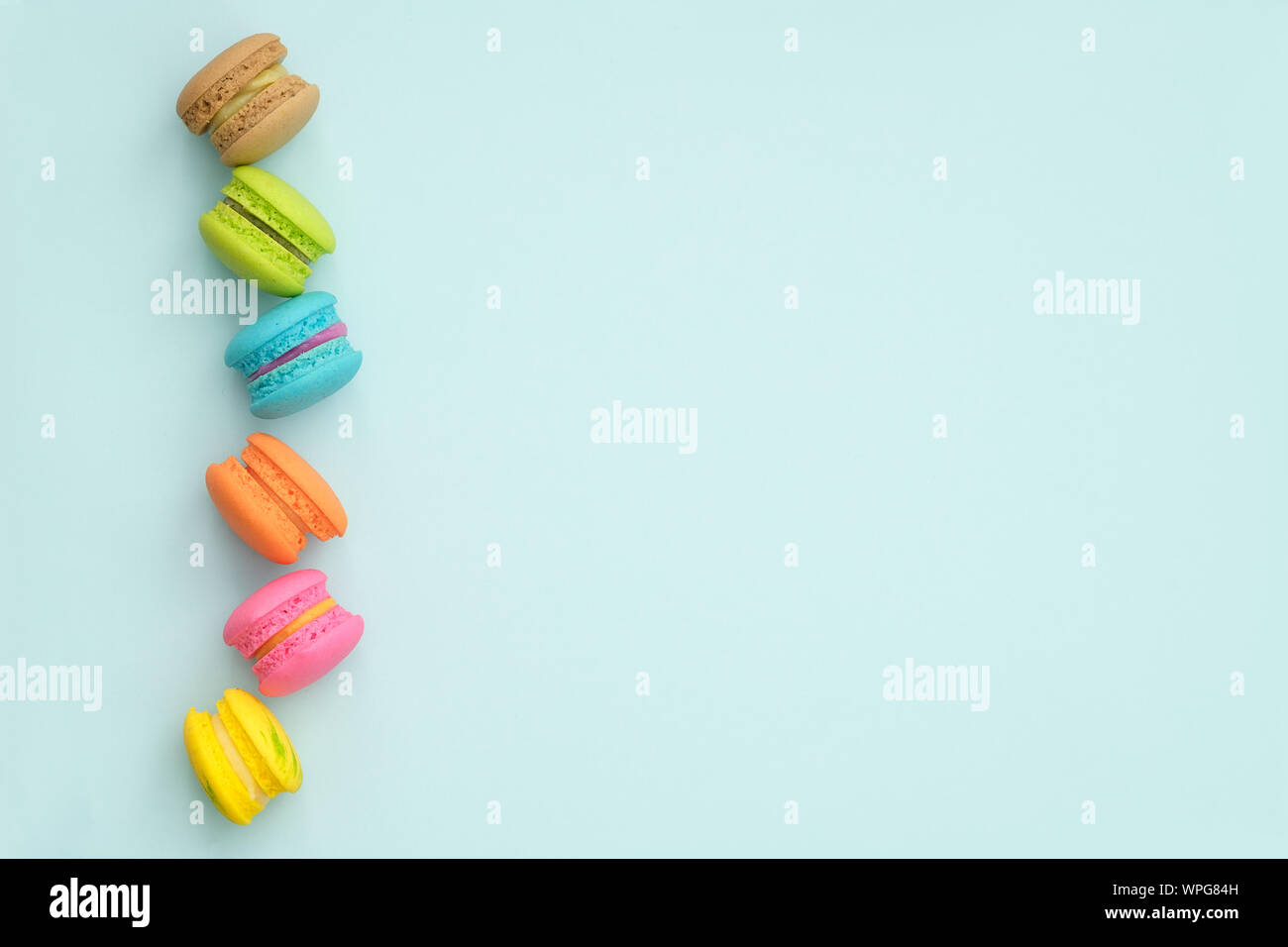 colorful macaroons on turquoise background, Sweet and tasty for cooking ...
