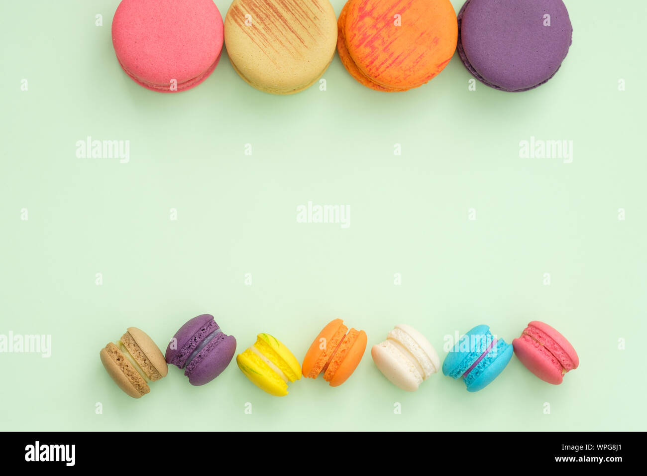 colorful macaroons on green background, Sweet and tasty for cooking and ...