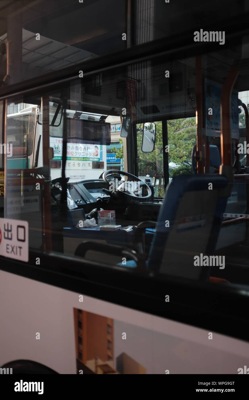 Vertical selective shot of the front driver seat of a bus Stock Photo ...