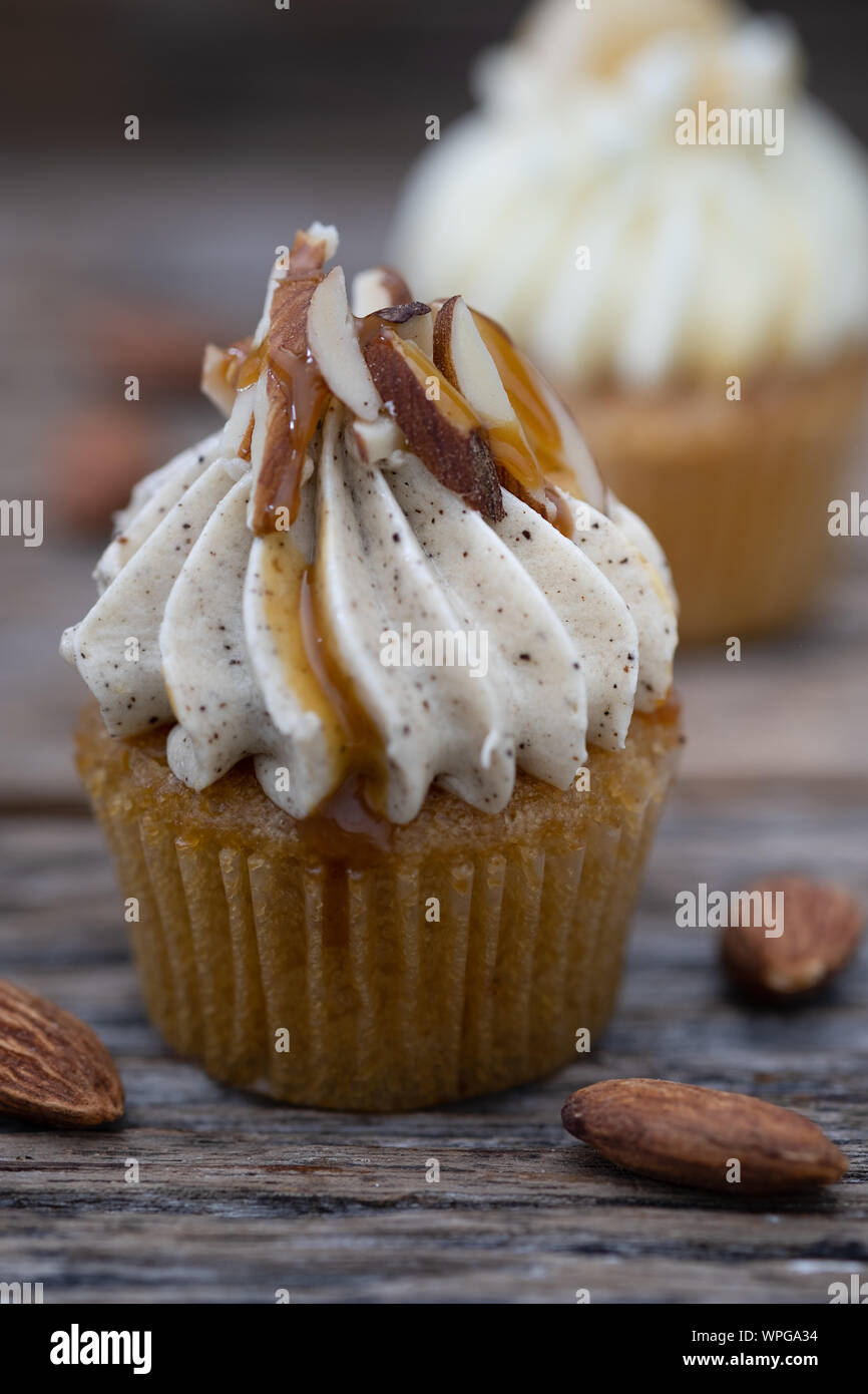 Tasty mini cupcakes on a vintage background, sweet dessert for ...