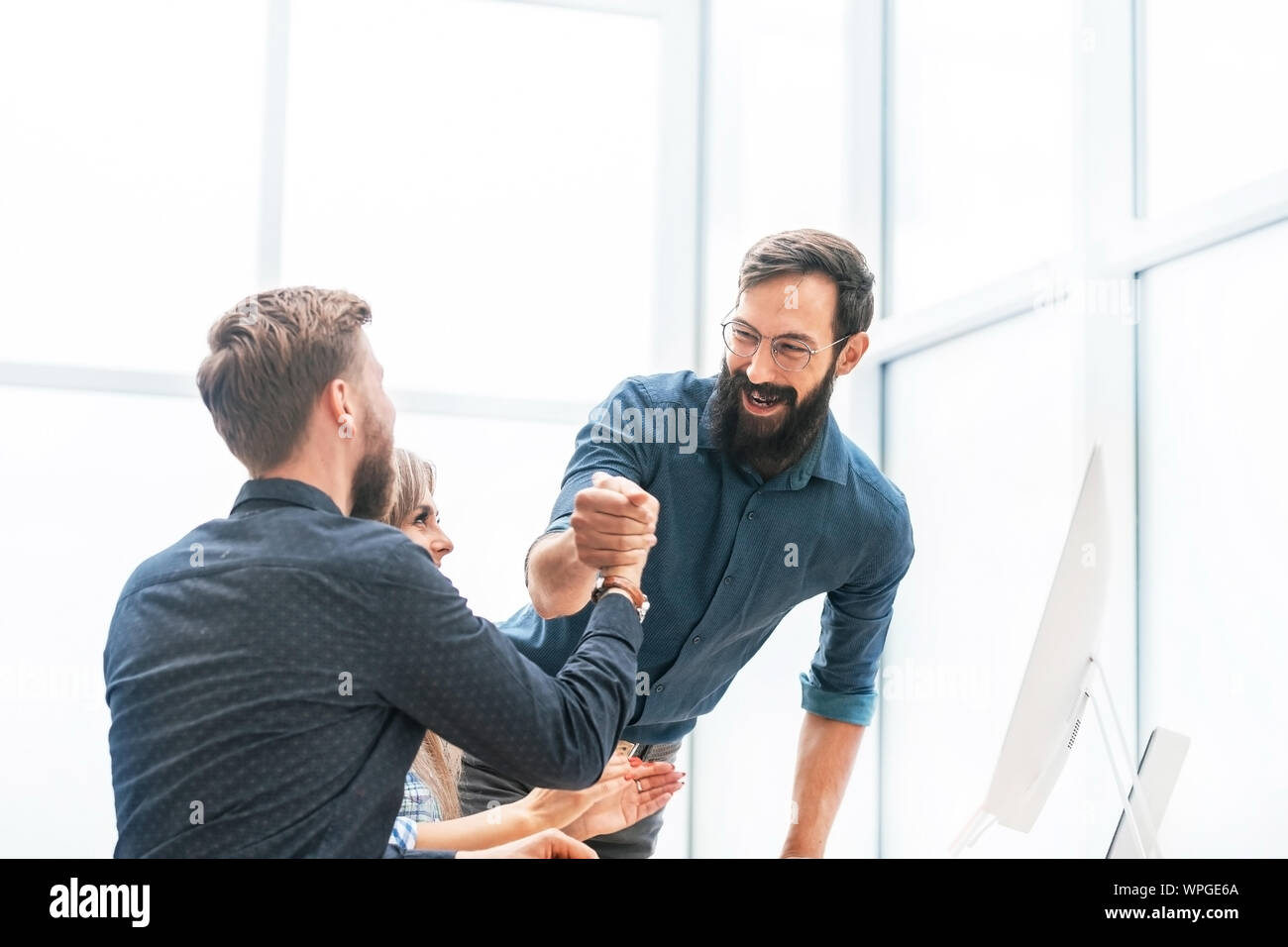 employees showing their success while working together Stock Photo - Alamy
