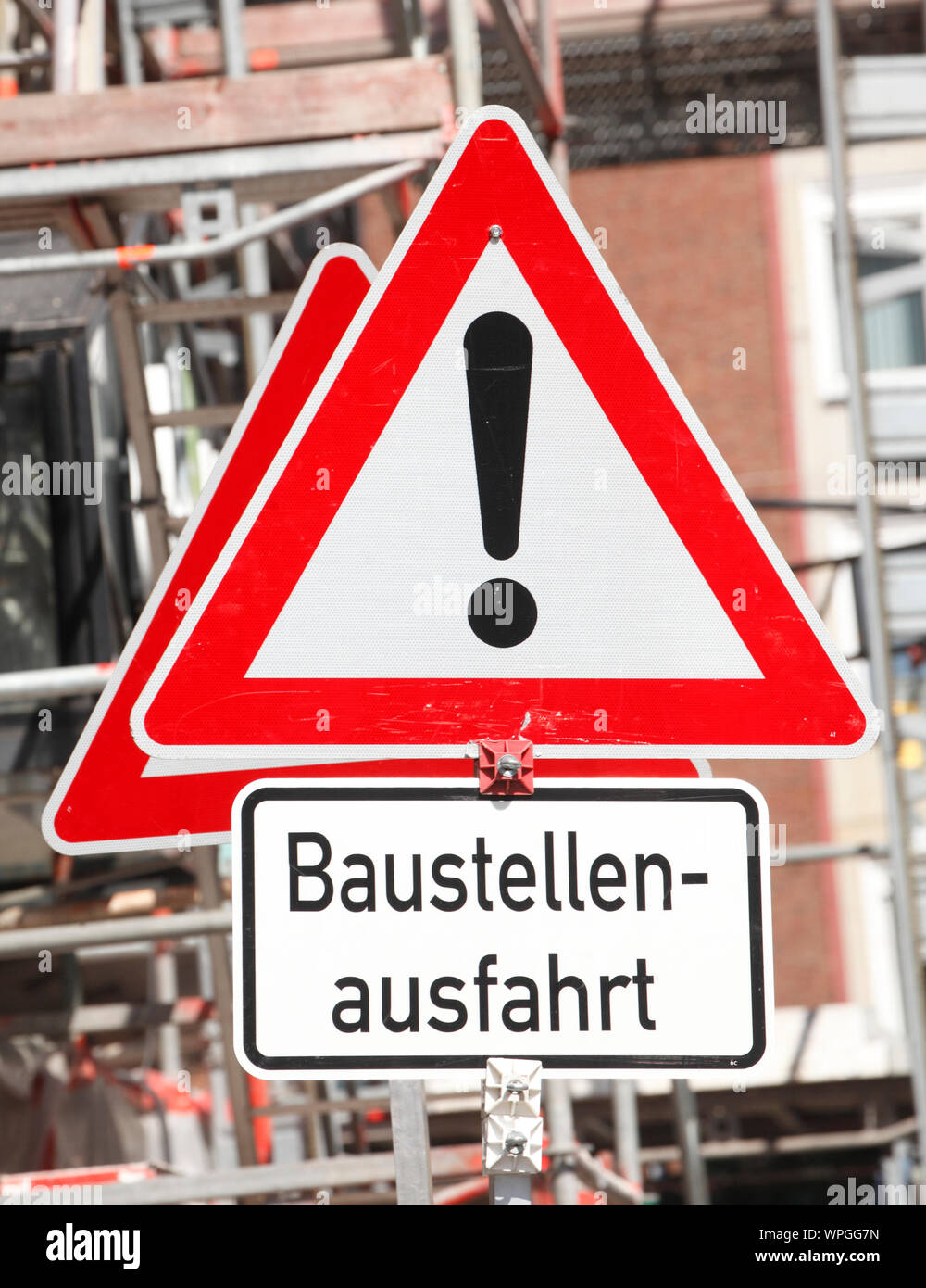 Road sign danger point, construction site exit Stock Photo - Alamy