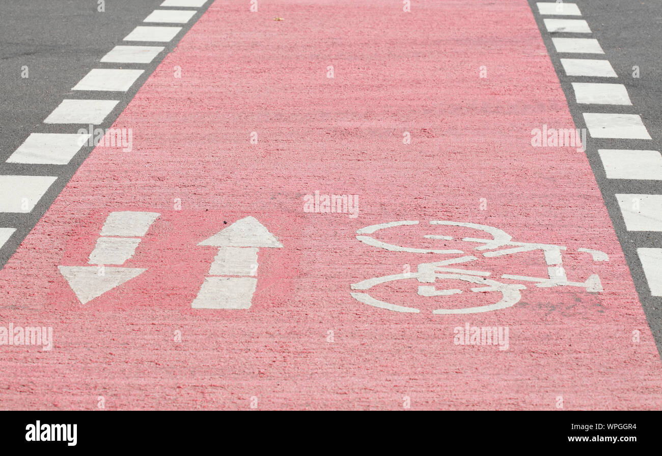 Red bike lane with ground marking, Germany Stock Photo - Alamy
