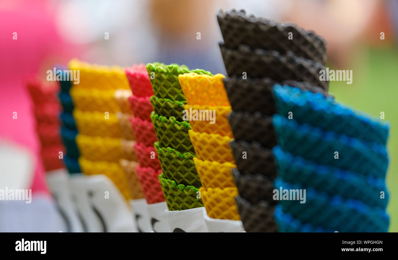 Empty differnt color ice cream wafle cones in row perspective Stock ...