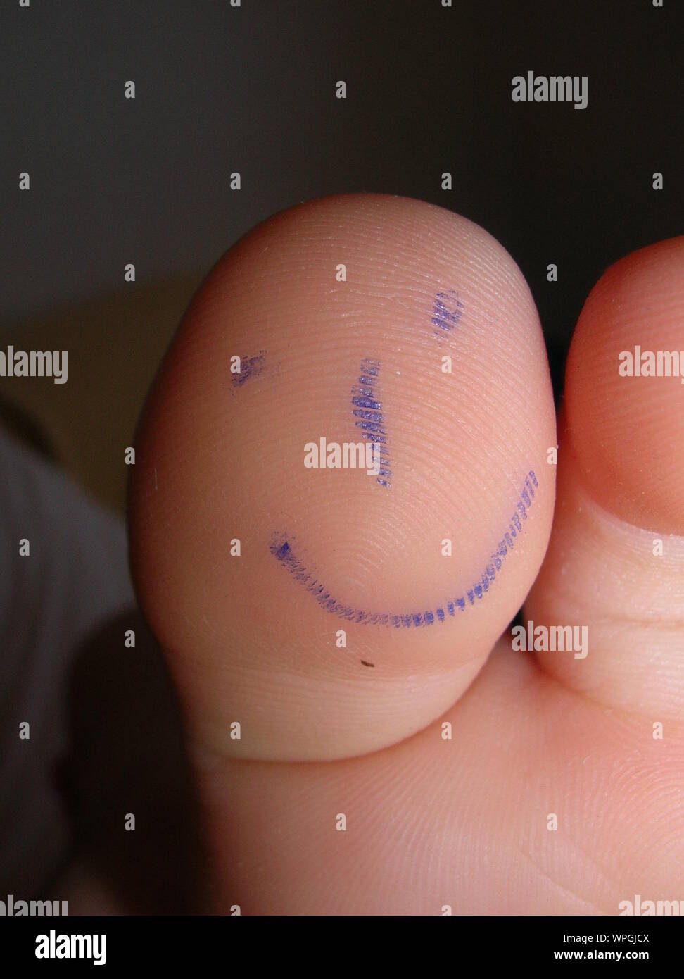 Smiley face on thumb hi-res stock photography and images - Alamy