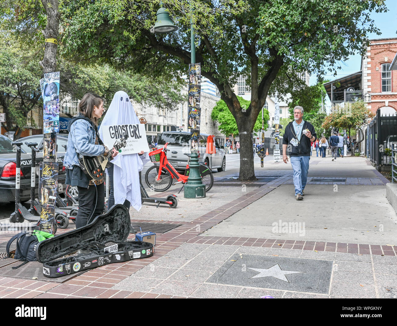 Street musician playing in downtown Austin Texas during SXSW festival ...