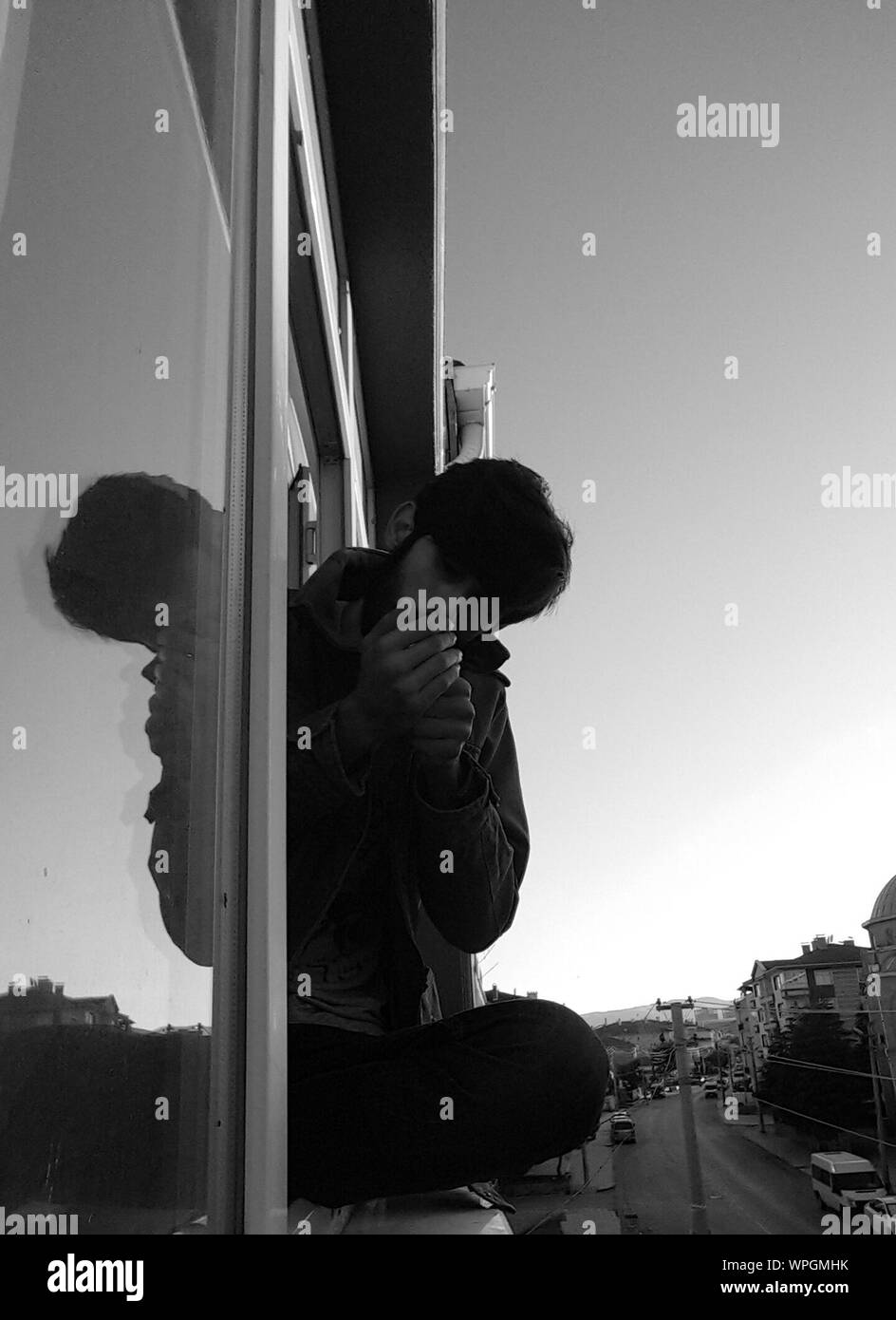 Young man reflection window Black and White Stock Photos & Images - Alamy