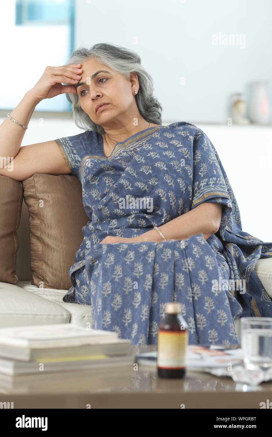 Senior woman suffering from fever Stock Photo - Alamy