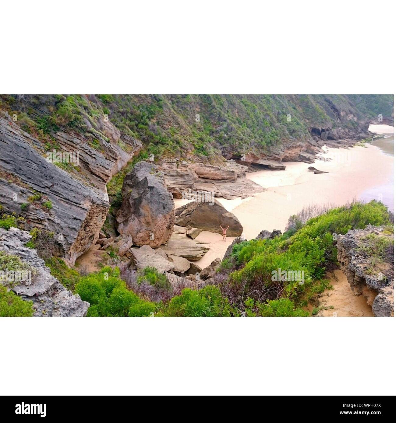 Cliff Surrounding Sea Bay Stock Photo - Alamy