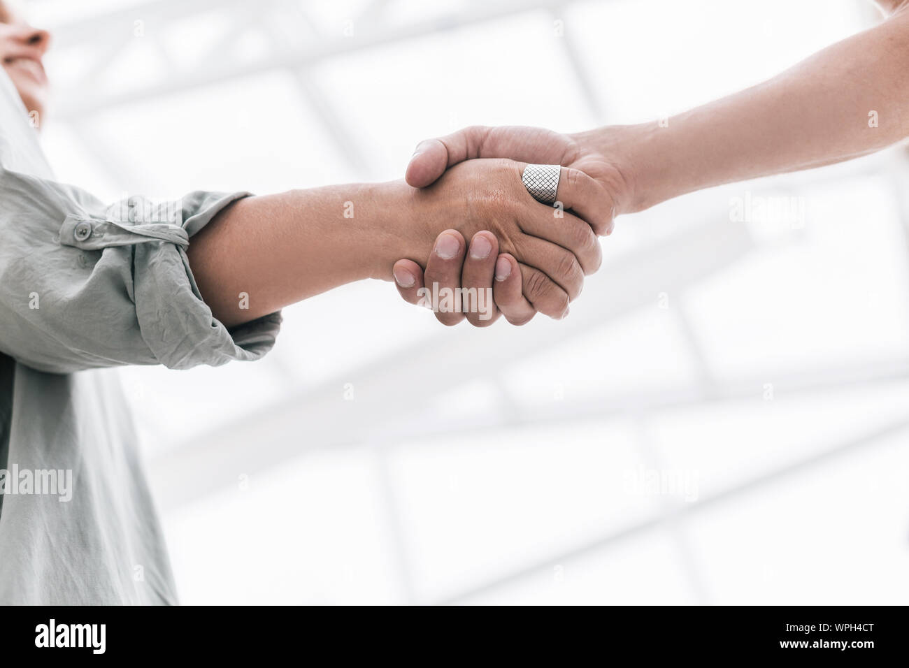 close up. handshake business partners on blurred office background ...