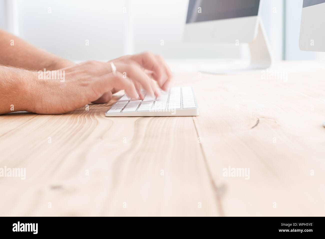 background image of a man working on a computer Stock Photo - Alamy