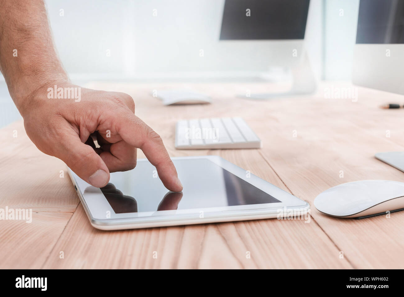 close up. man tapping on the digital tablet screen Stock Photo - Alamy