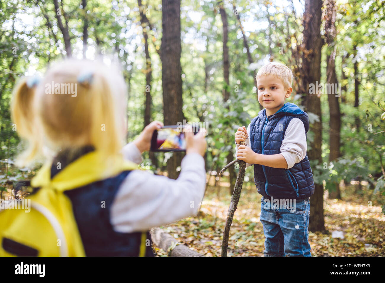Children preschoolers Caucasian brother and sister take pictures of ...