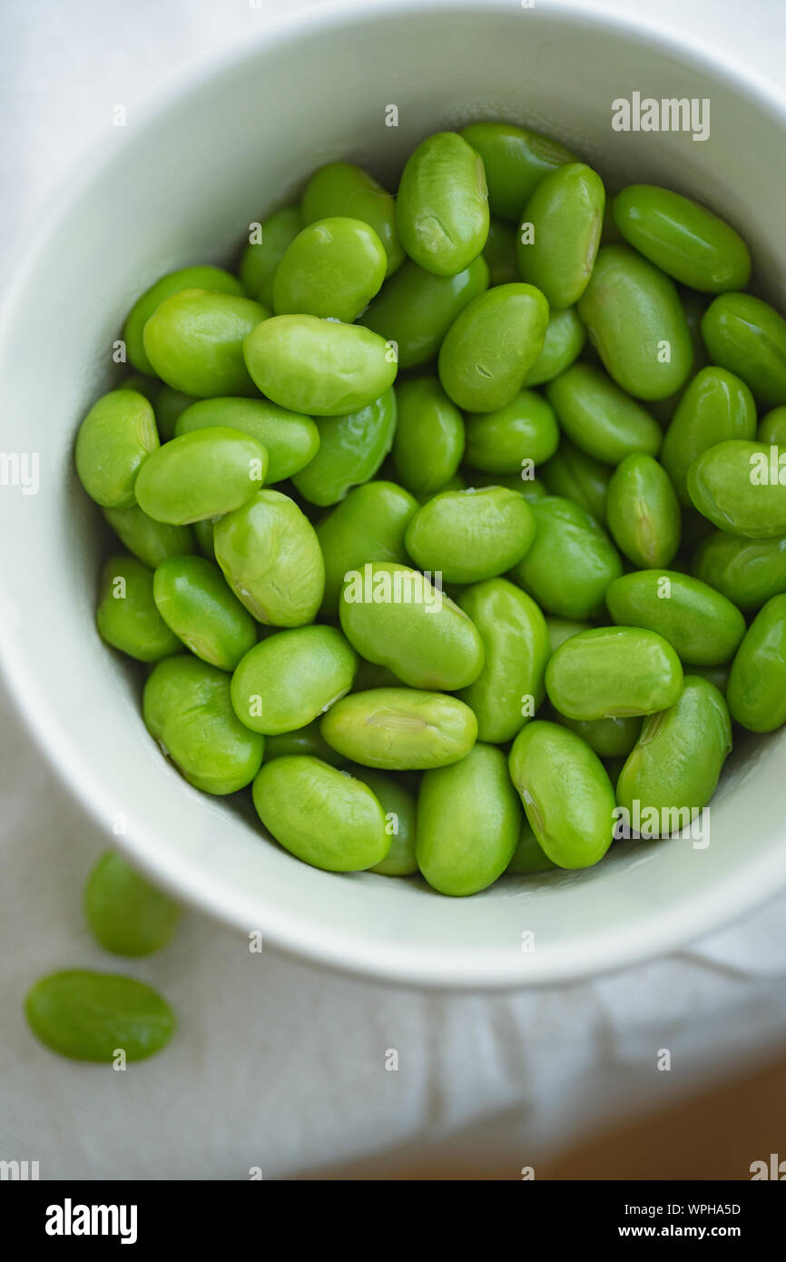 Macro image of edamame beans on bowl on a table Stock Photo - Alamy