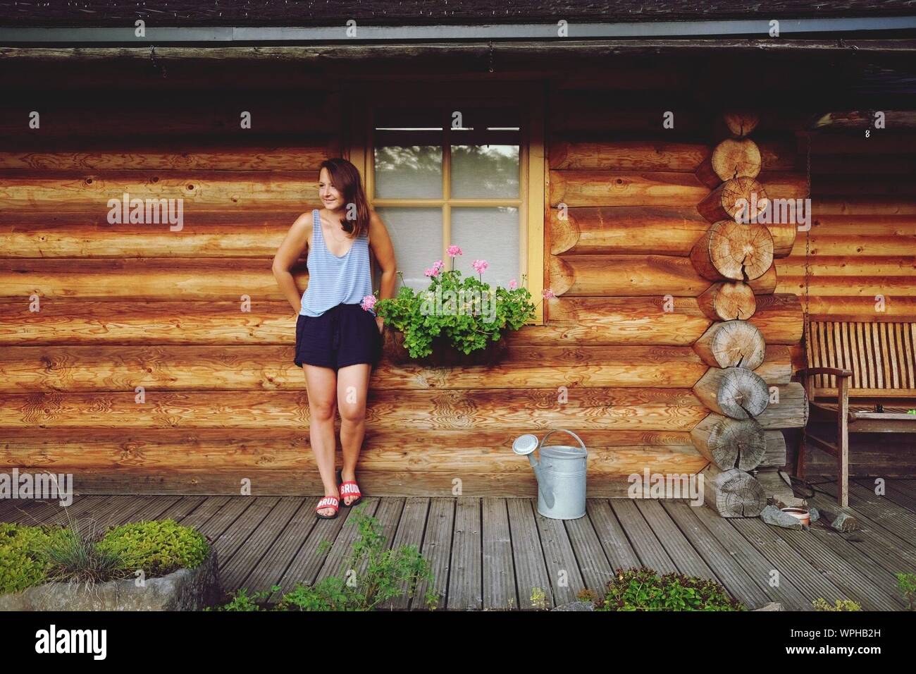 Standing by log cabin hi-res stock photography and images - Alamy