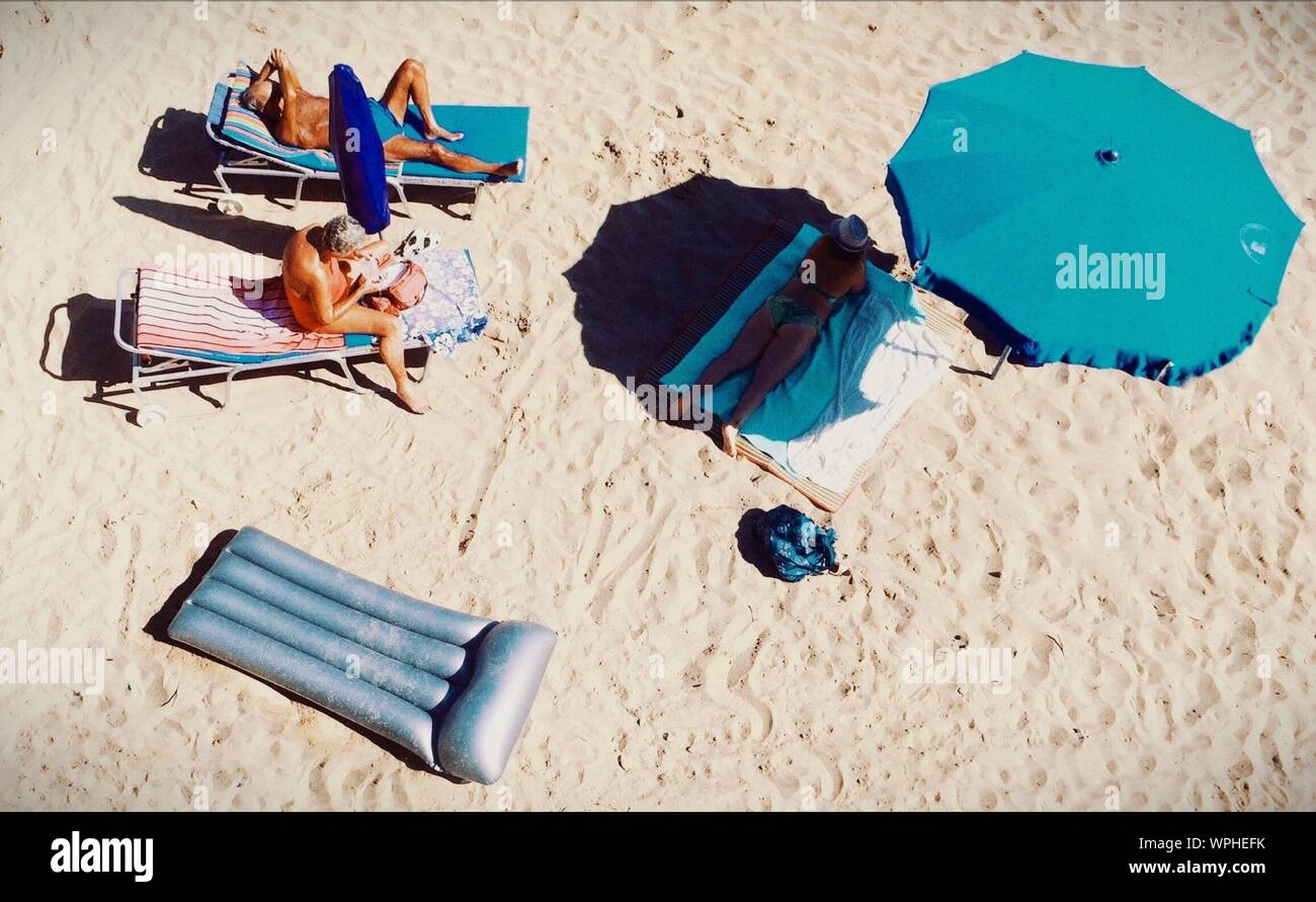 Sunbathing senior beach hi-res stock photography and images - Alamy