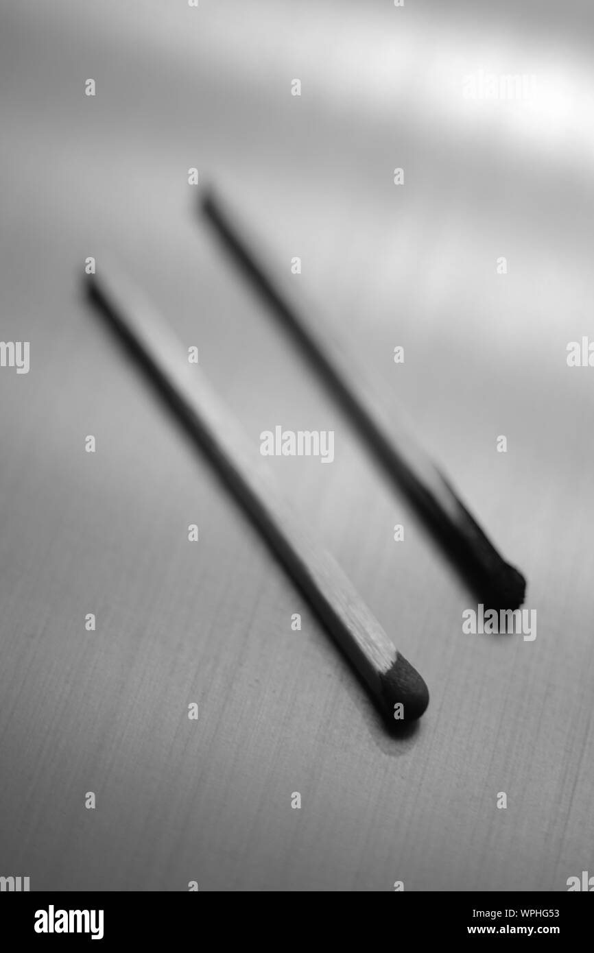 one used, and the other new matches on the table, black and white ...