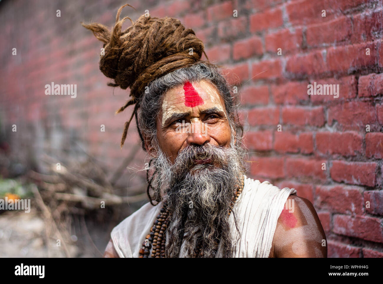 Hindu holy man poses for a photograph at the courtyard of the ...