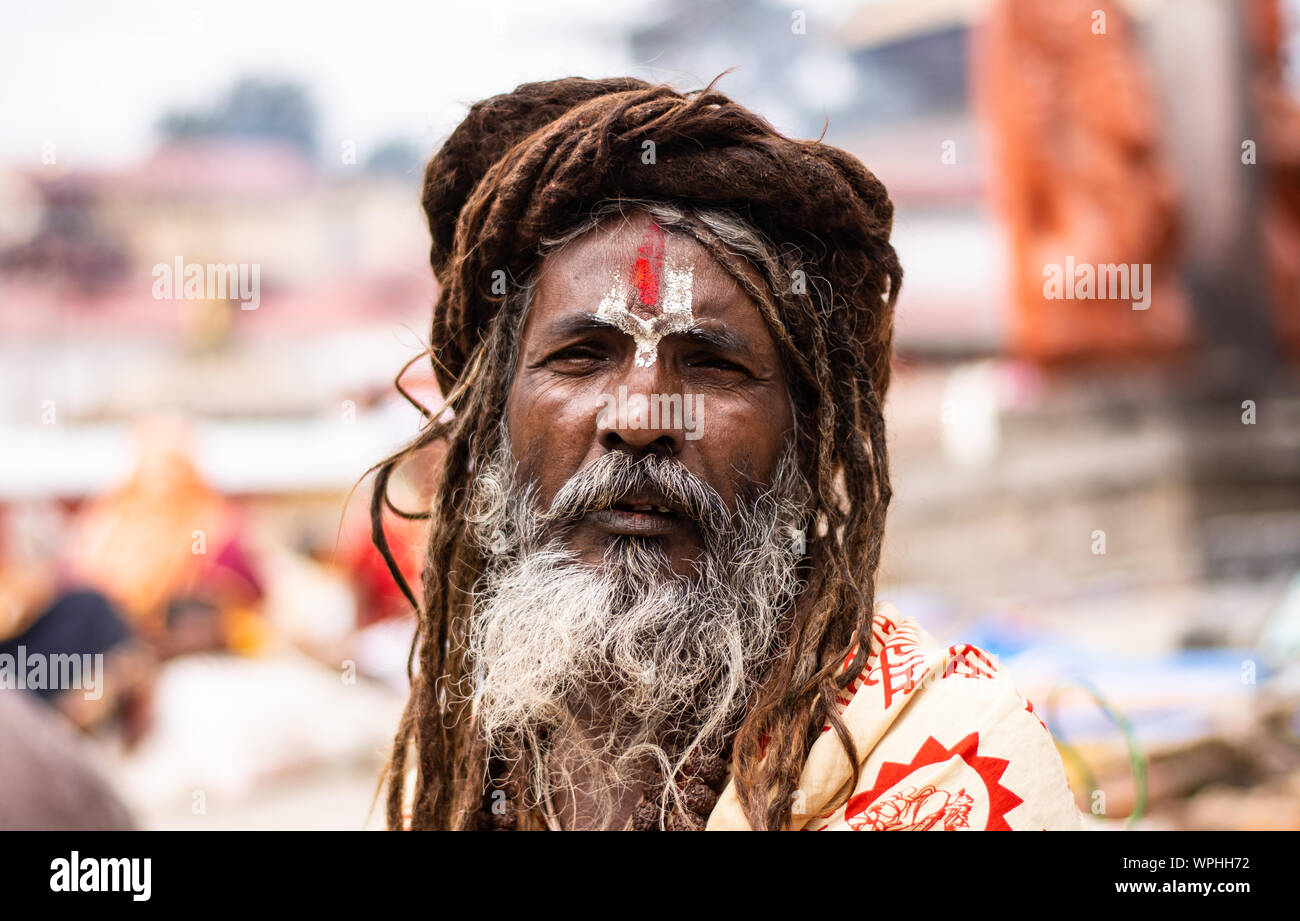 Hindu holy man poses for a photograph at the courtyard of the ...