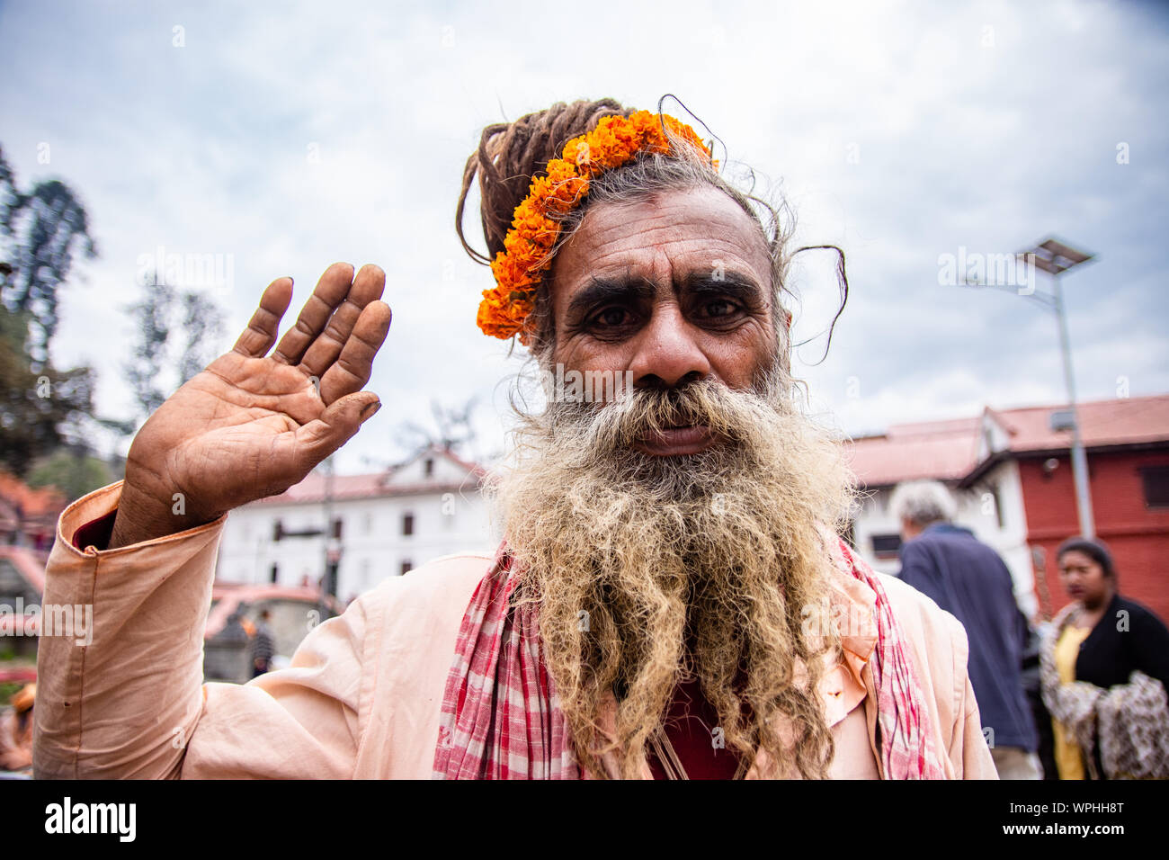 Hindu holy man poses for a photograph at the courtyard of the ...