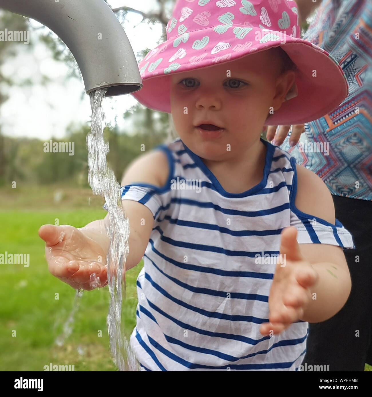 Girl touching water hi-res stock photography and images - Alamy