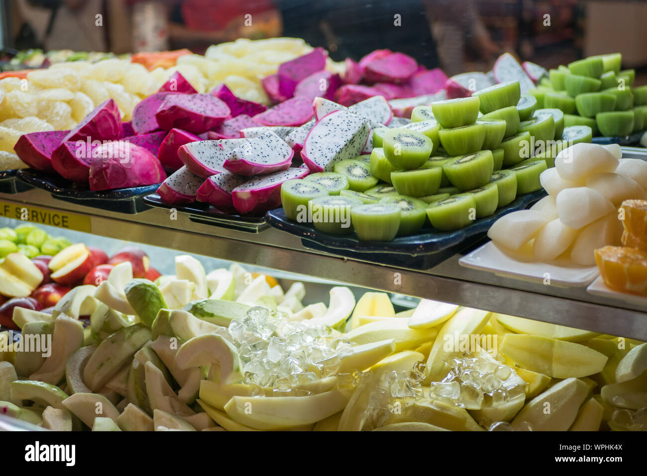 Fresh fruits cut in pieces selling at the fruit stall Stock Photo - Alamy