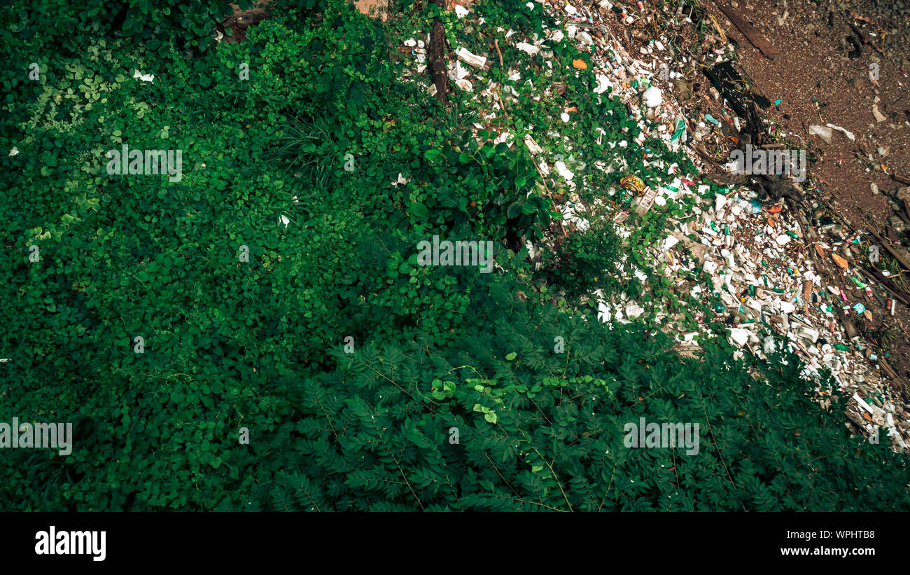 environmental damage of garbage in the nature. garbage and smog in ...