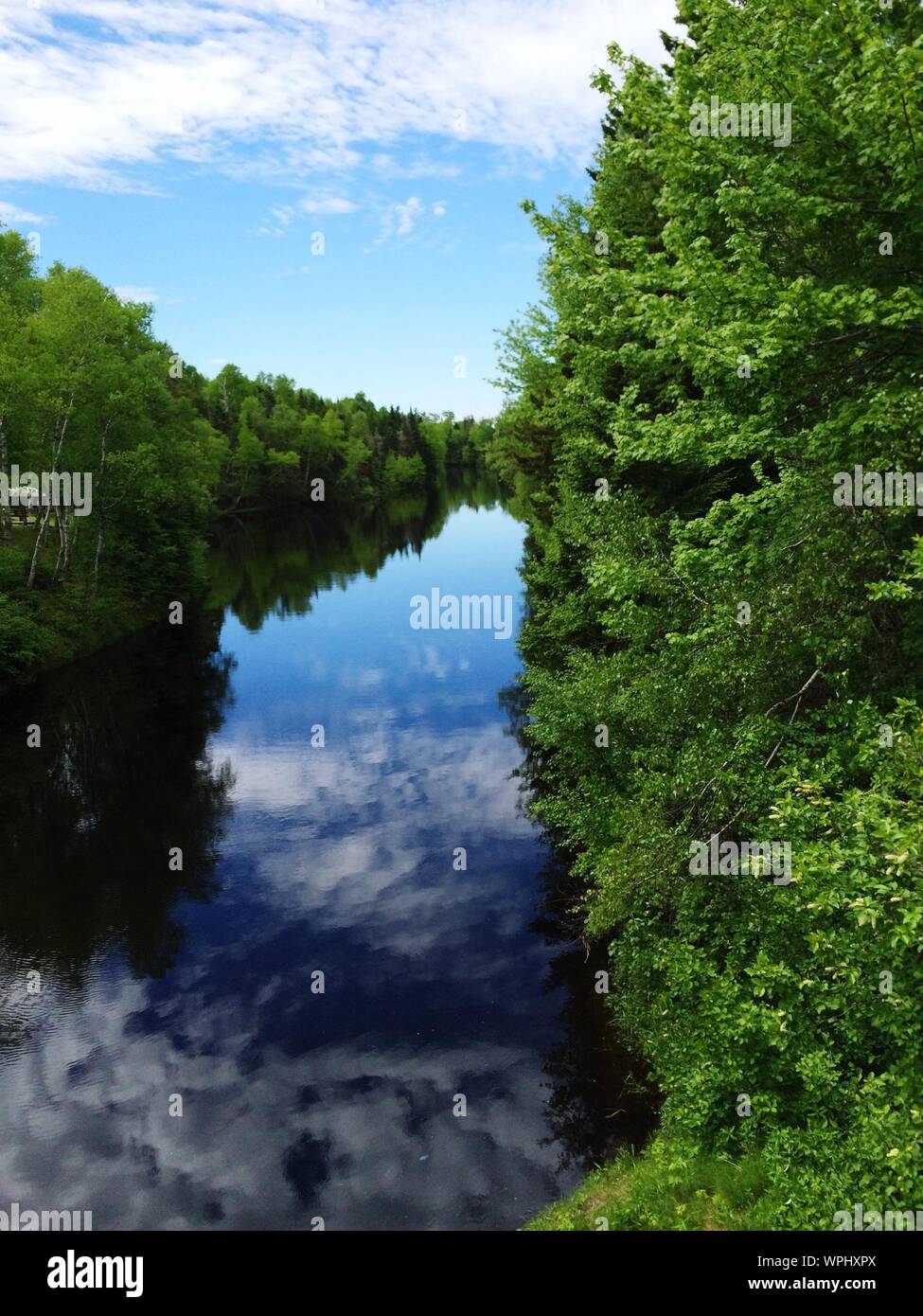 Sky Reflecting In River Stock Photo - Alamy