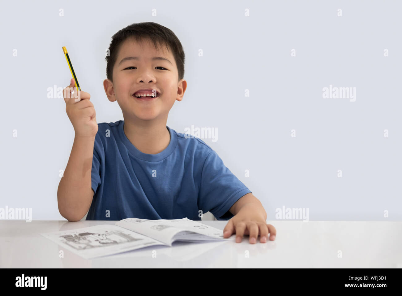 Happy asian boy raising hand hi-res stock photography and images - Alamy