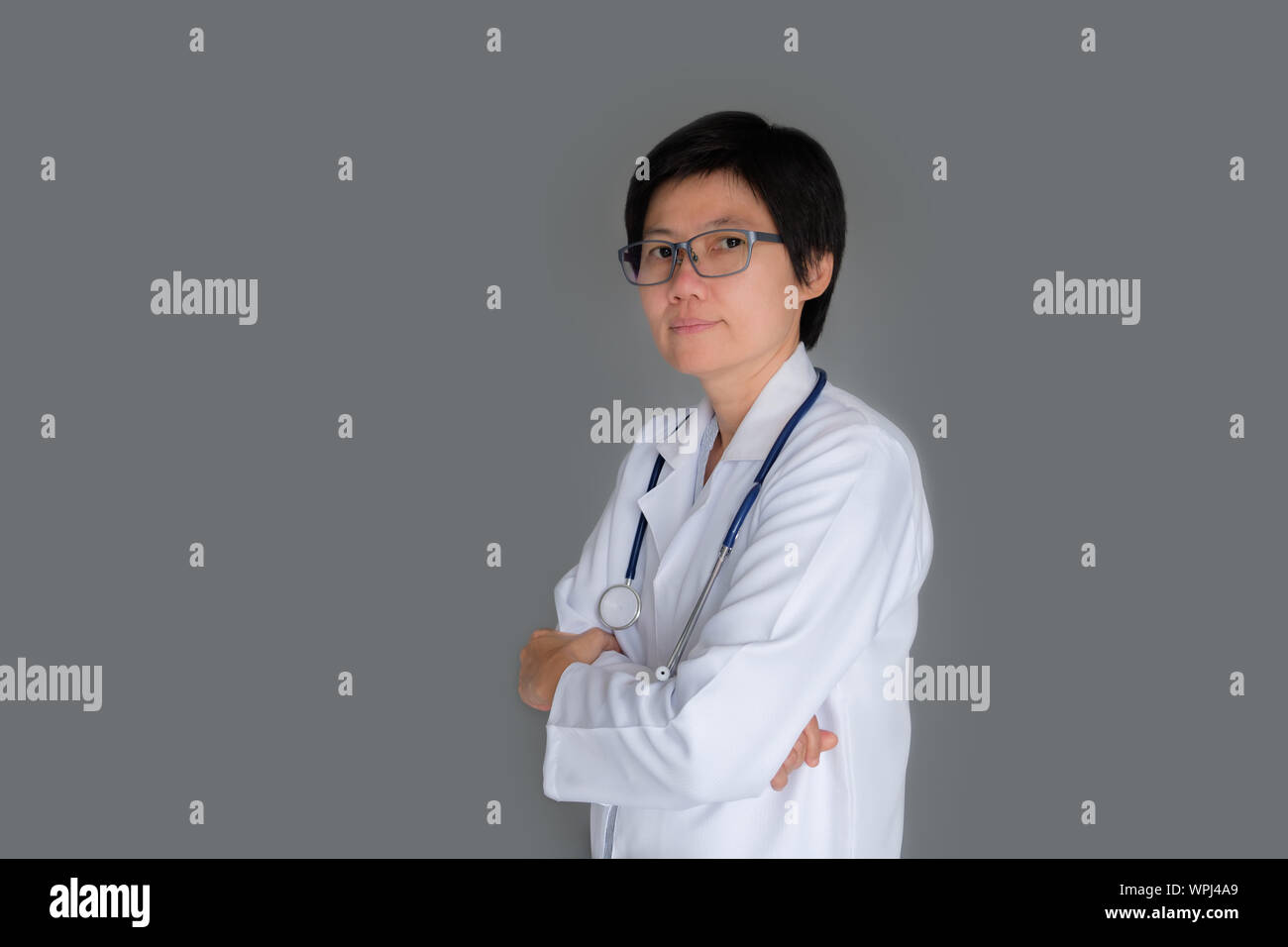 Cheerful mature doctor in hi-res stock photography and images - Alamy