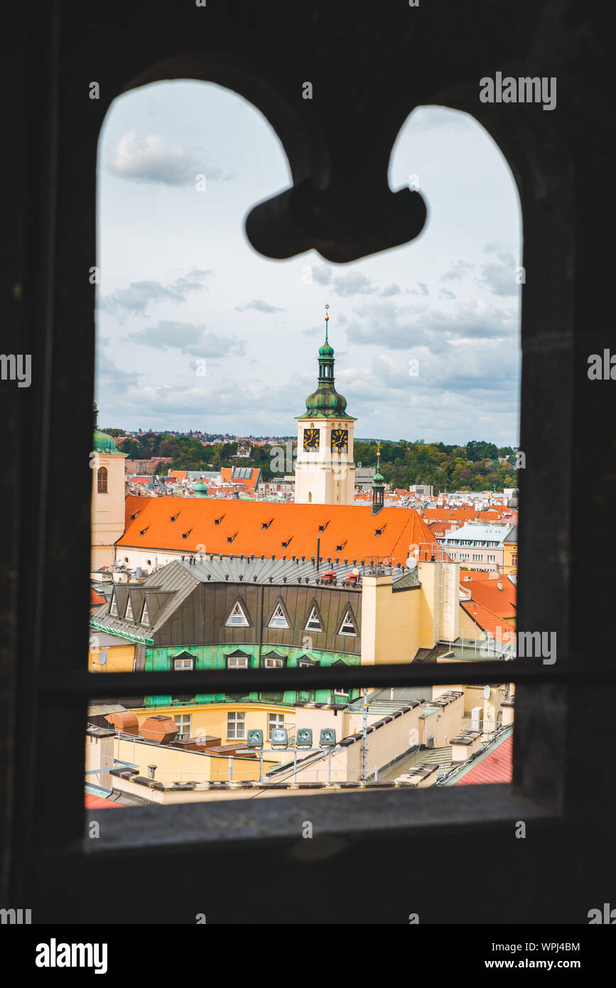 view of prague city through old window of the church Stock Photo - Alamy