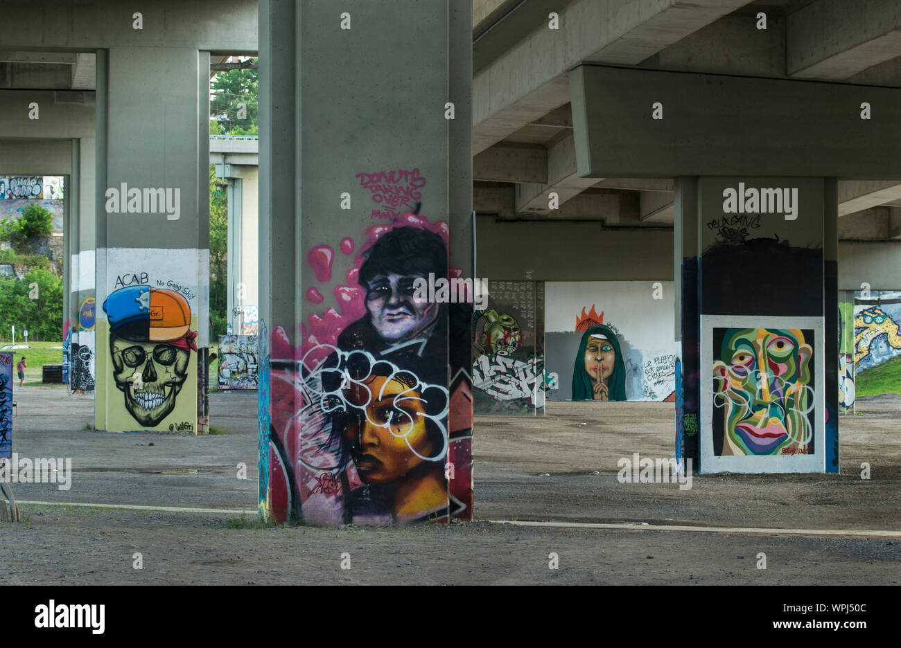 Highway overpass art painted on the concrete pillars of the Dufferin ...