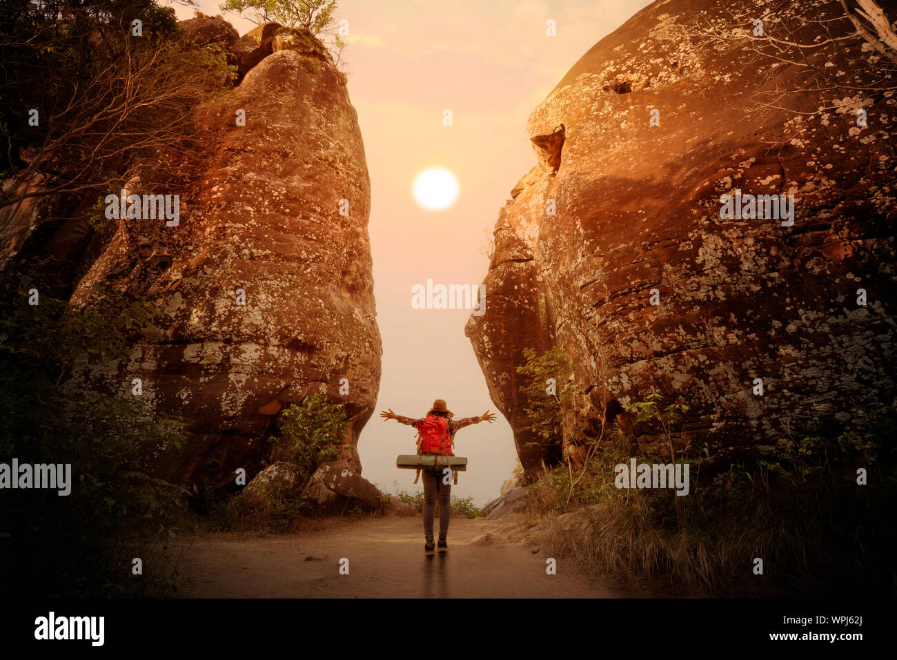 Woman standing and open hand on sunset or sunrise background Stock ...