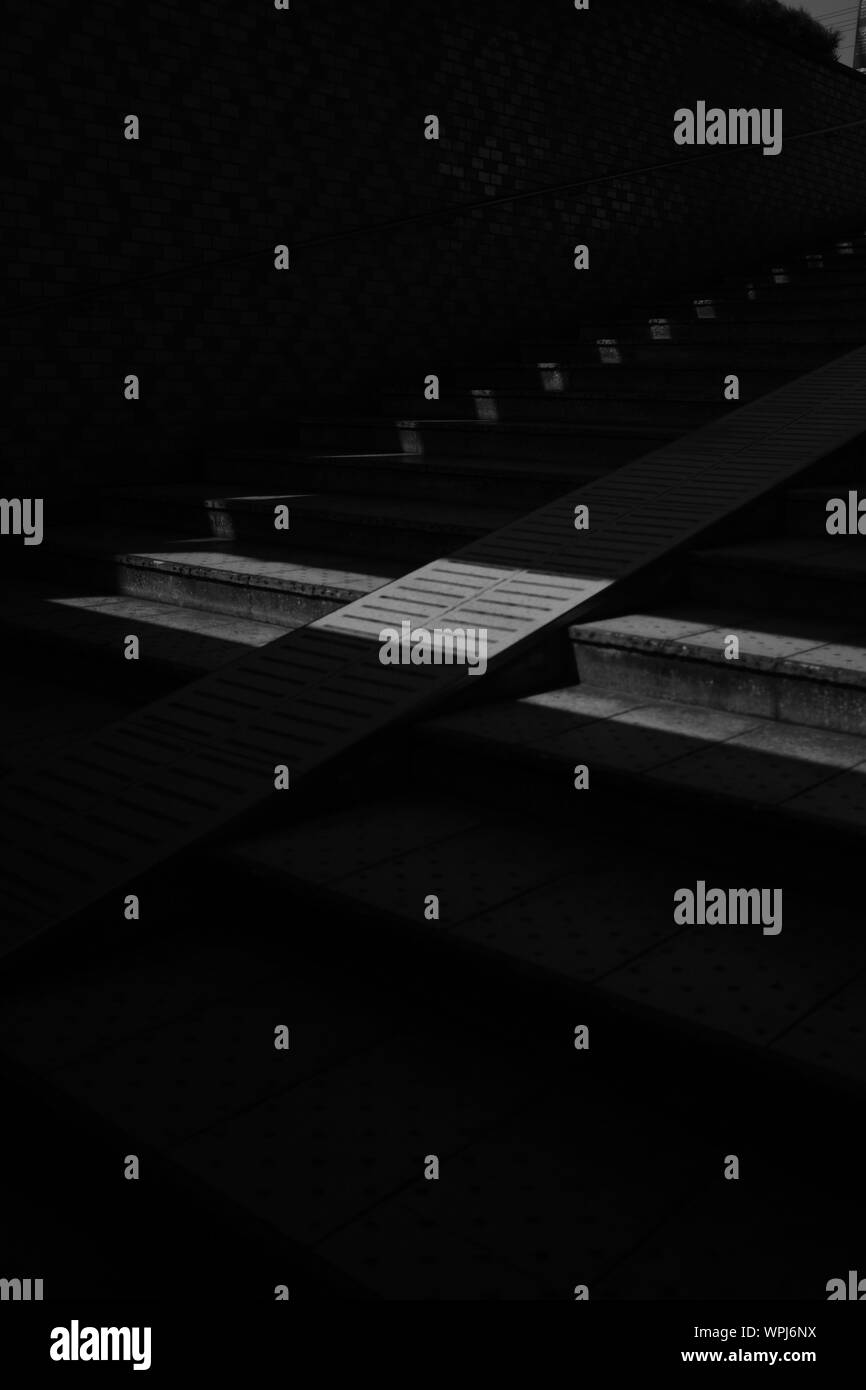 Vertical grayscale shot of wheelchair ramp stairs Stock Photo - Alamy